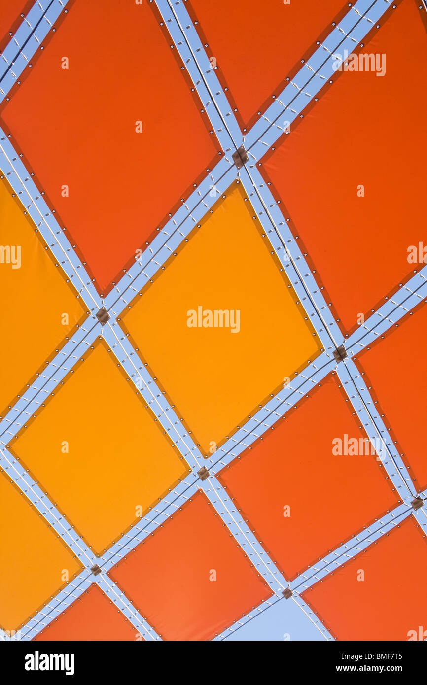 Orange and yellow diamond shaped panels stretched across blue sky Stock ...
