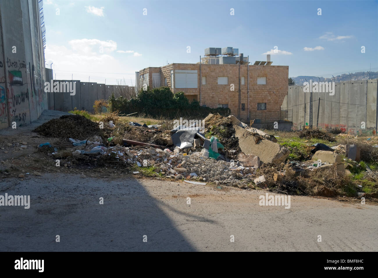 A palestinian house in Bethlehem surrounded by the separation wall ...