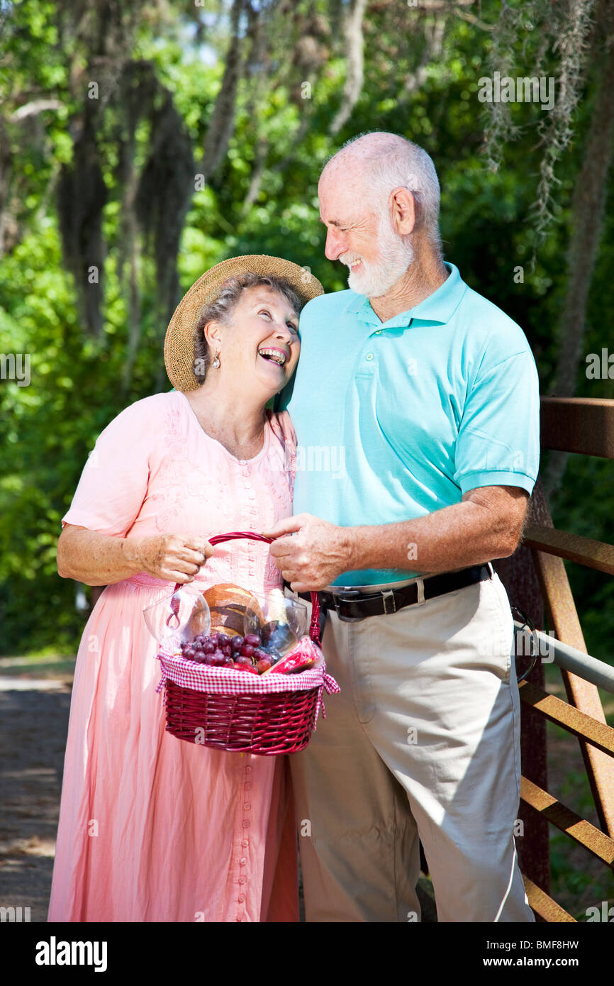 Elderly couple carrying basket hi-res stock photography and images - Alamy