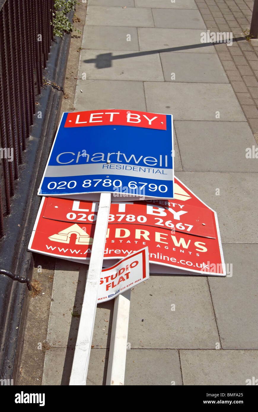 to let signs laying on a pavement in putney, southwest london, england ...