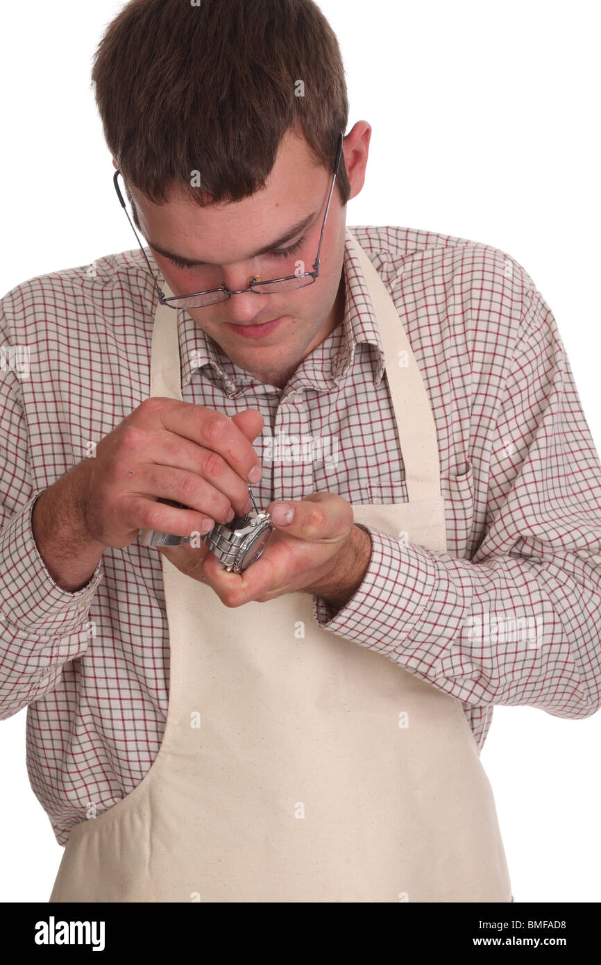 skilled young man repairing a watch Stock Photo - Alamy