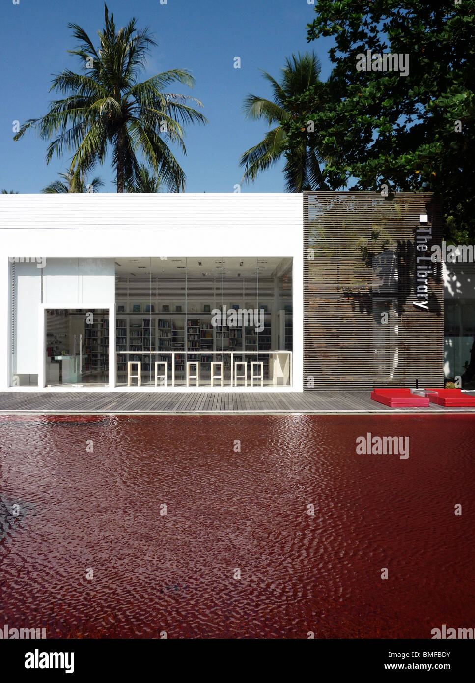 The red swimming pool and library at The Library, Chaweng, Koh Samui ...