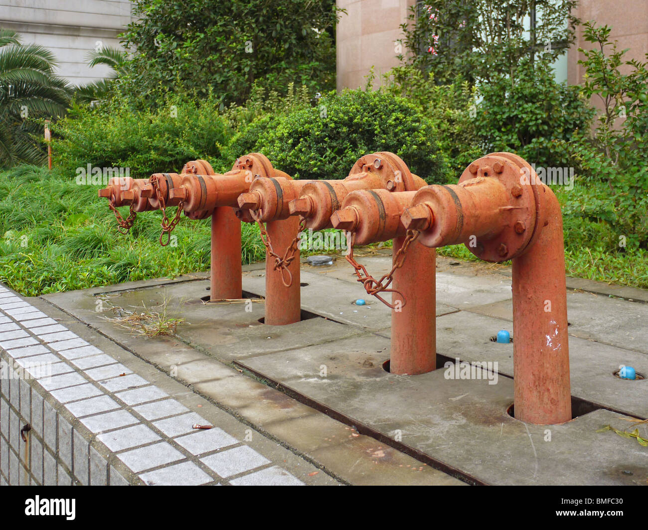 Line of orange fire hydrants in Shanghai, China Stock Photo - Alamy