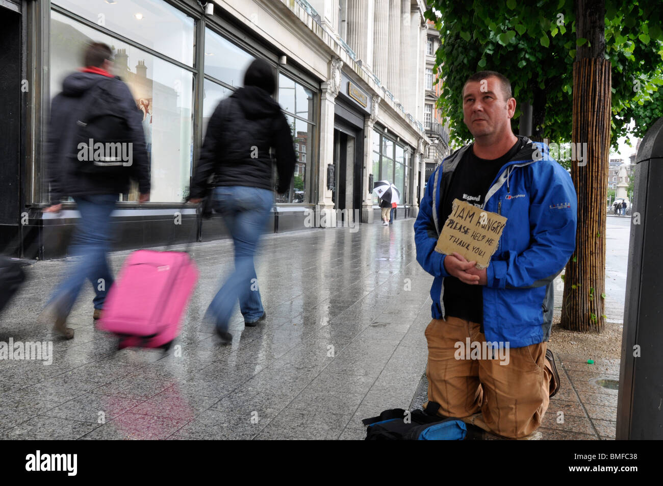 Man on knees begging in hi-res stock photography and images - Alamy