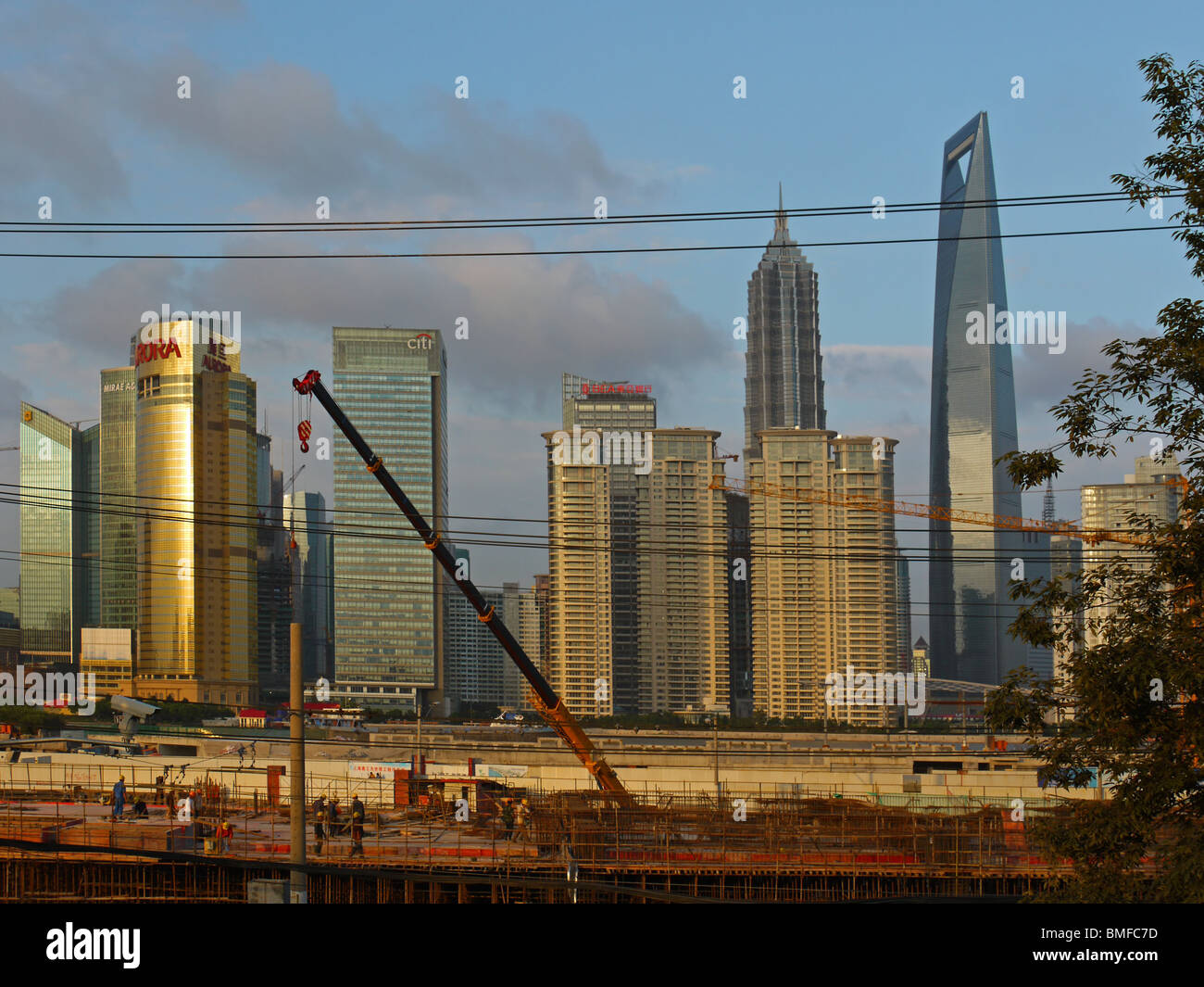 New construction site in front of skyscrapers line in Shanghai, China ...