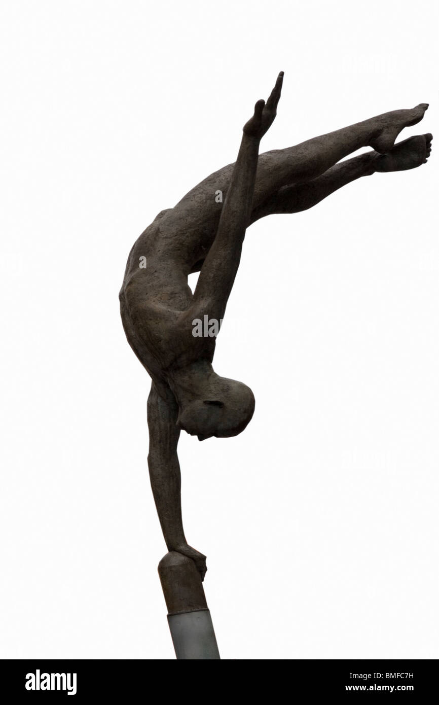 Bronze statue of a man doing a handstand Stock Photo - Alamy