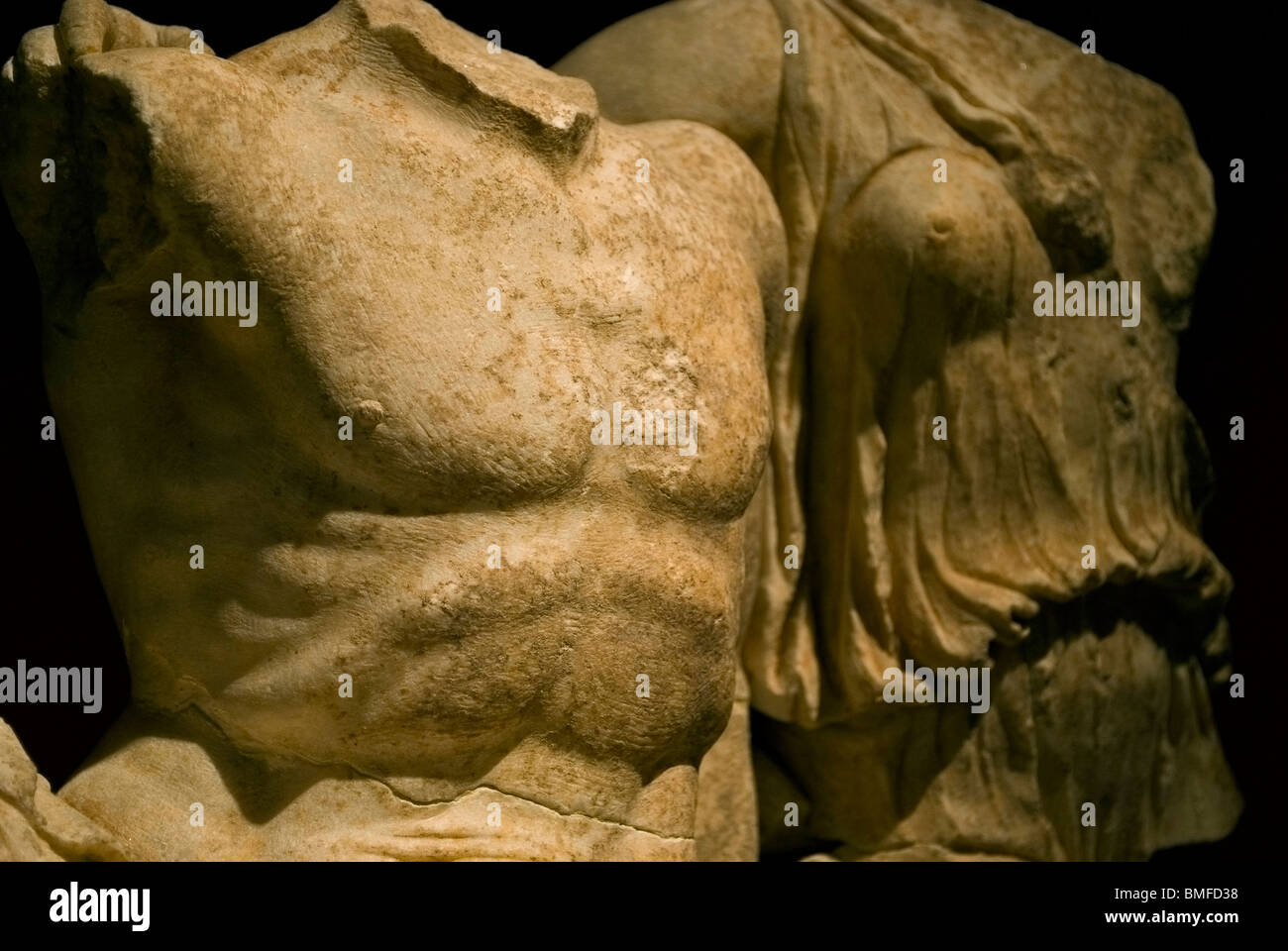 Male and female torsos of statues used to decorate a part of a pediment ...