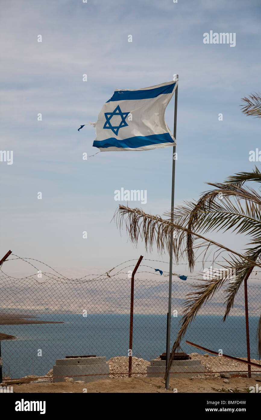 A torn Israeli flag blowing in the wind Stock Photo - Alamy