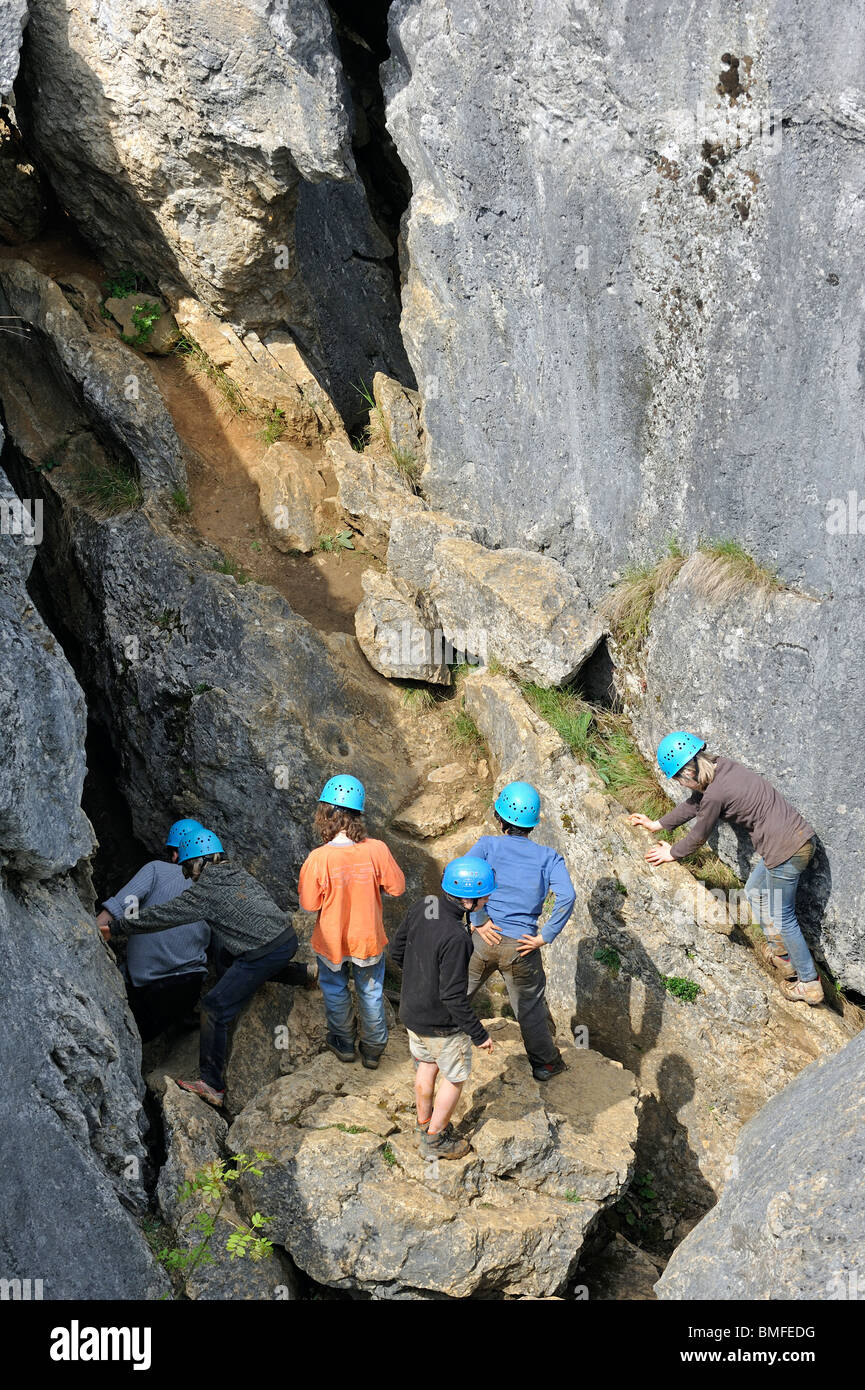 Children during survival day clambering on rocks in the nature reserve ...