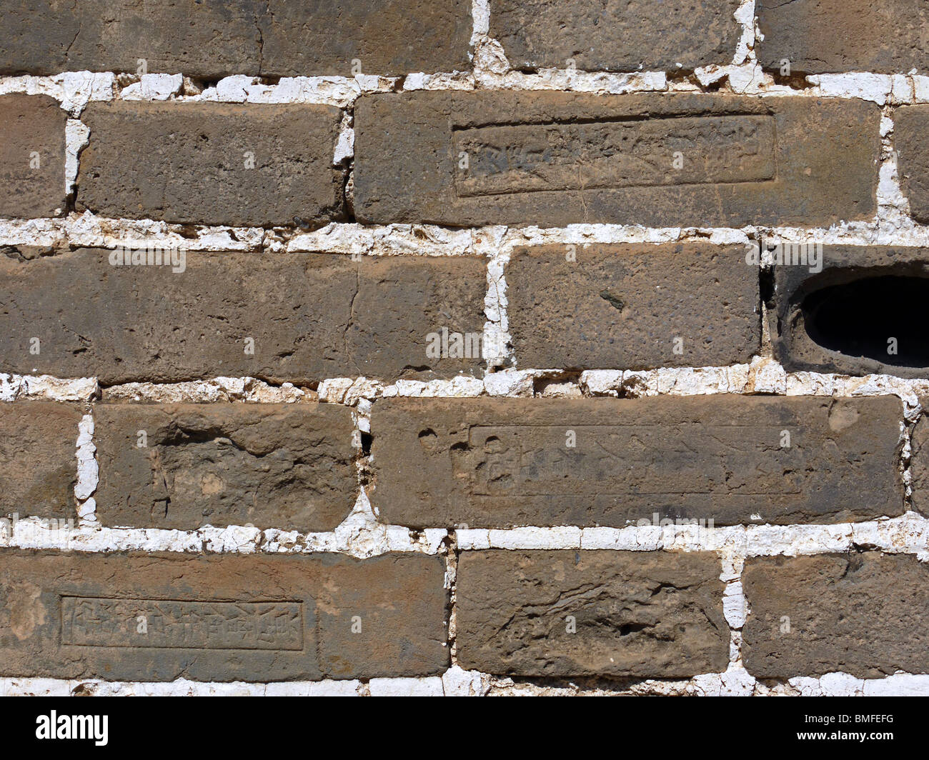 Ancient bricks with hieroglyphs in the Great Wall of China, close-up ...
