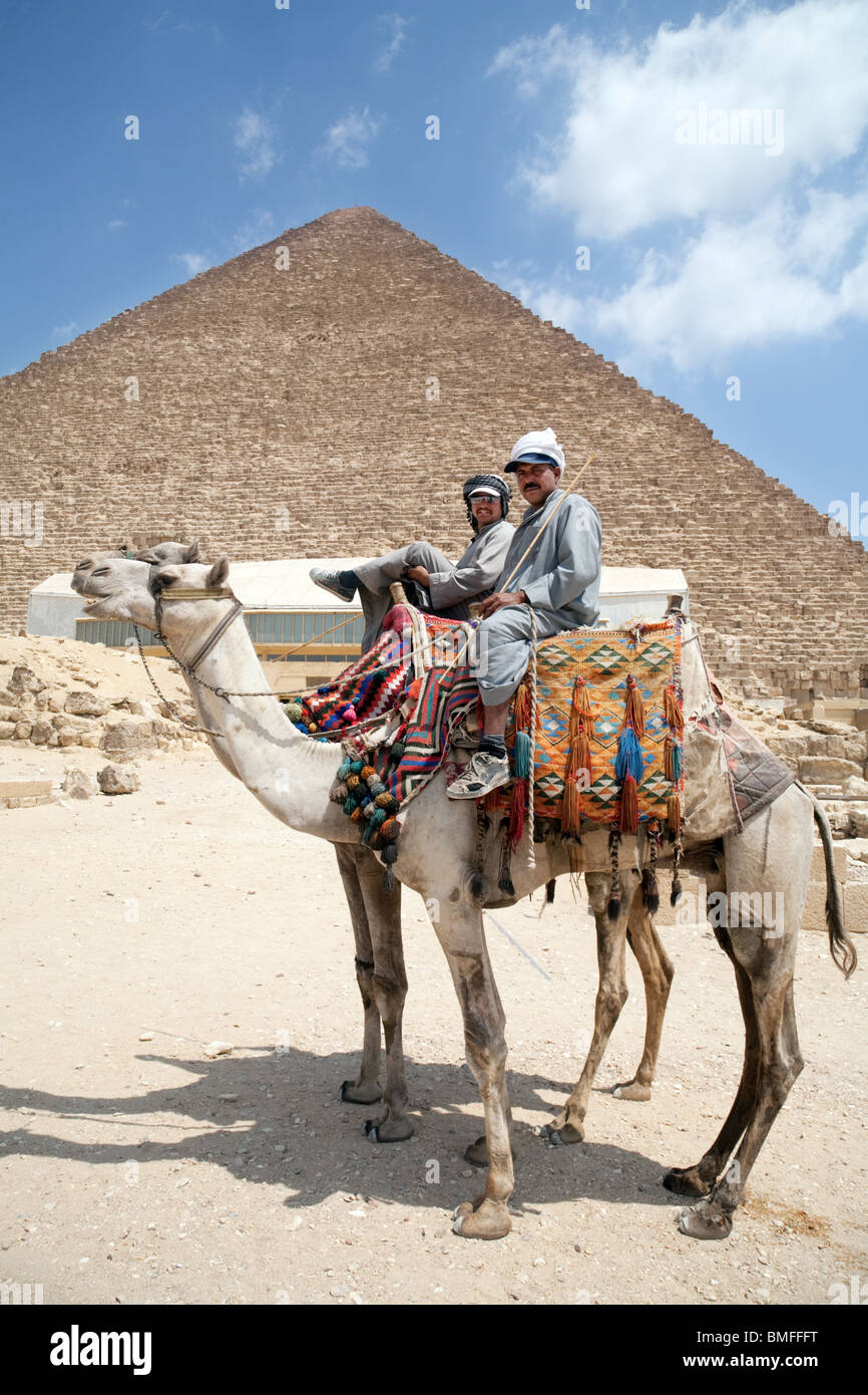 Two camel riders in front of the Great Pyramid of Cheops (Khufu) at ...