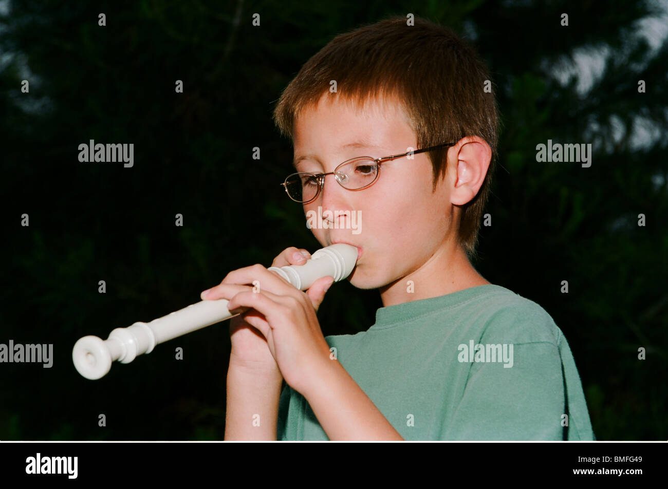 Young boy playing a recorder Stock Photo - Alamy