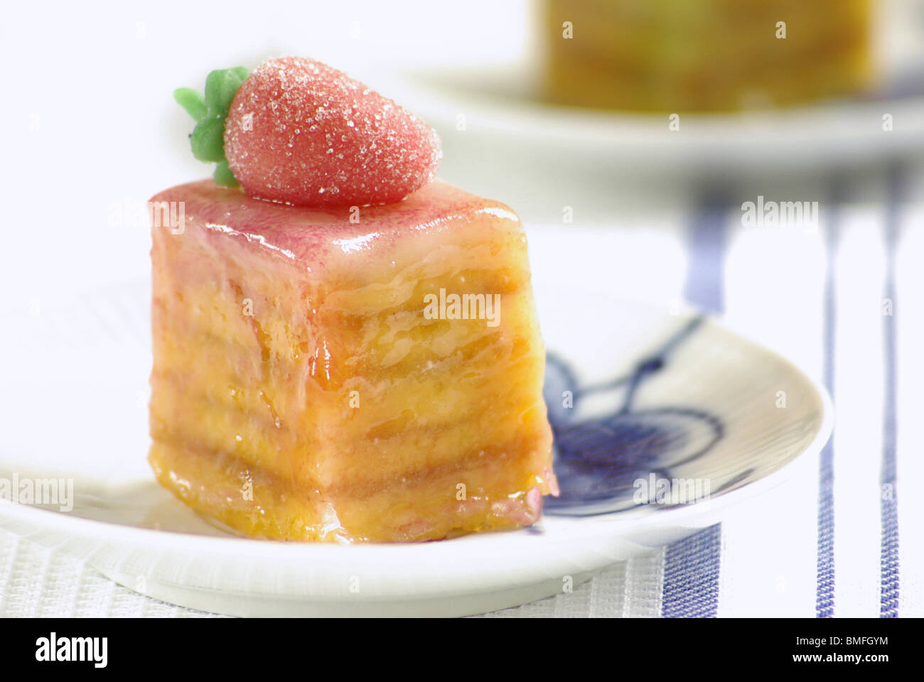 Pink Petit Fours On A Plate Stock Photo - Alamy