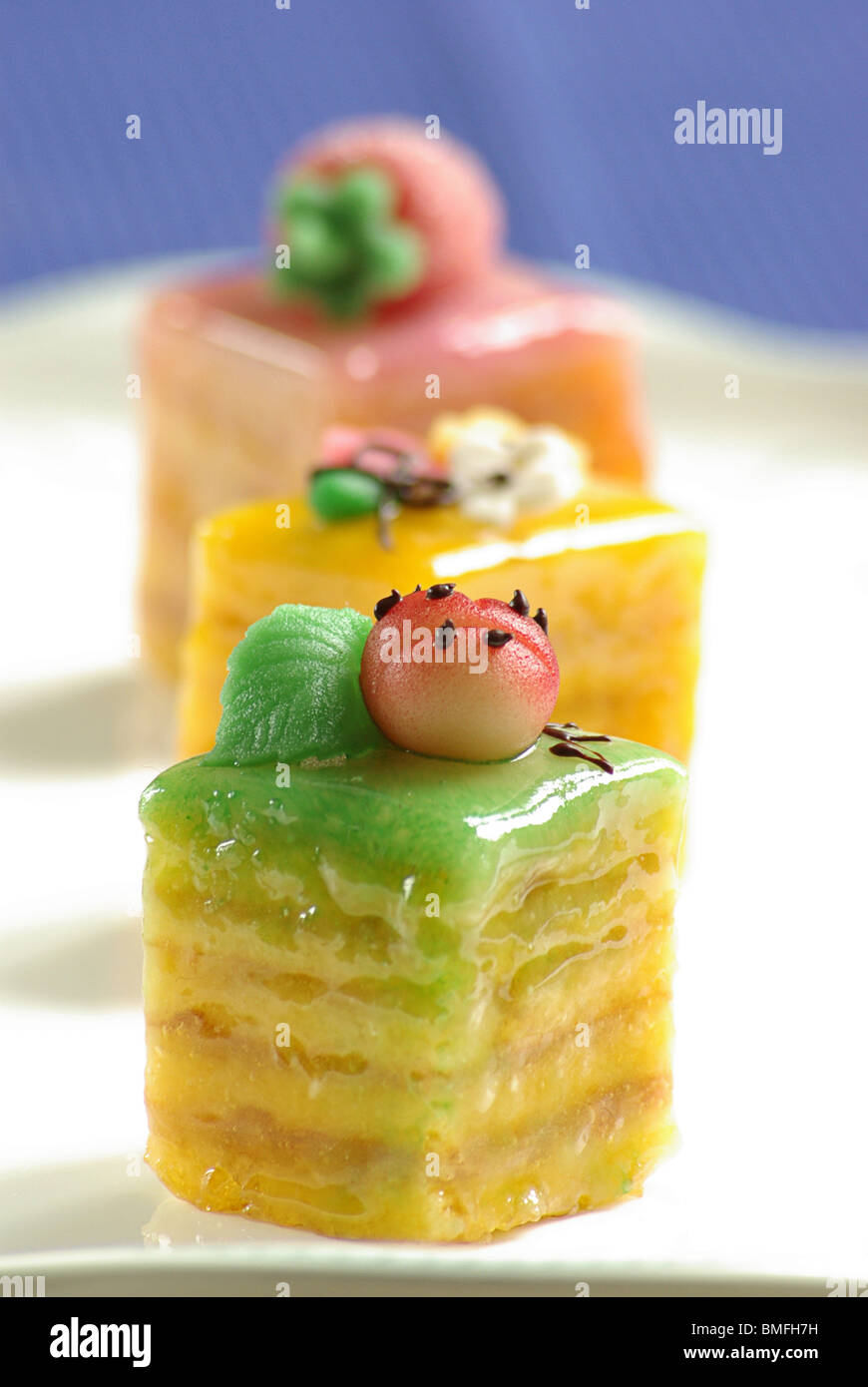 Nicely Decorated Petit Fours On A Plate Stock Photo - Alamy