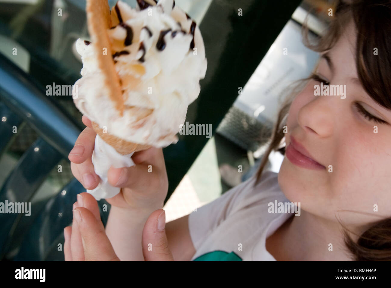Girl eating "ice cream" gelato cone outdoor in Italy Stock Photo - Alamy