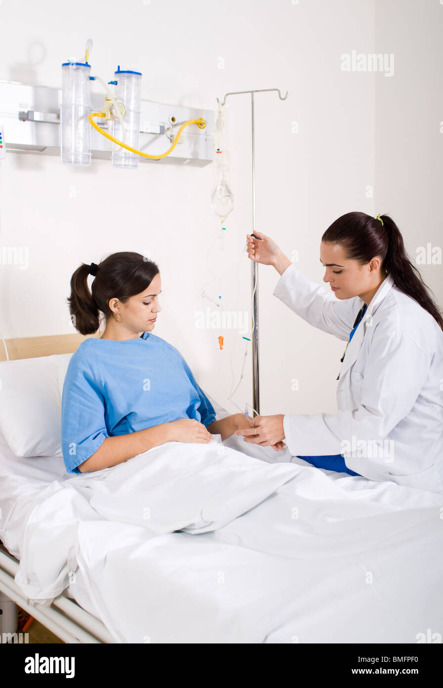 doctor or nurse helping patient with iv drips Stock Photo - Alamy
