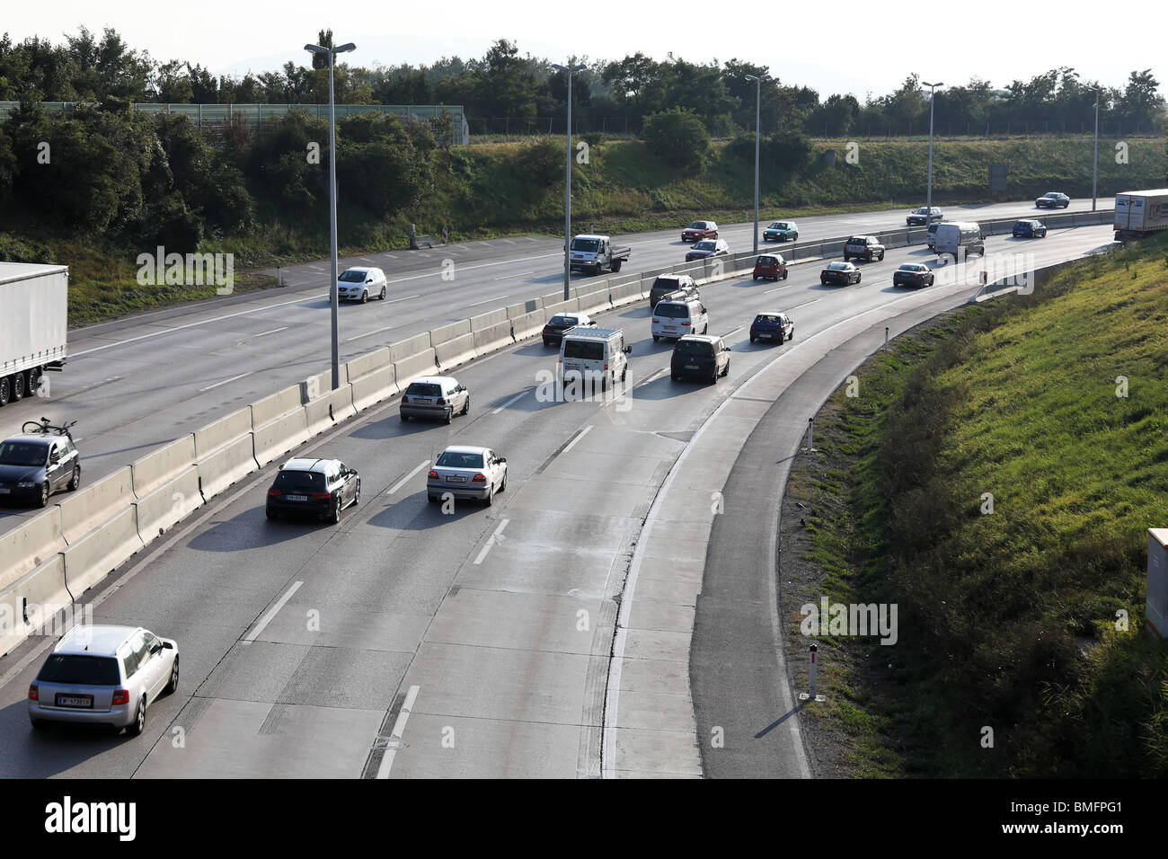 Cars drive on a highway Stock Photo - Alamy