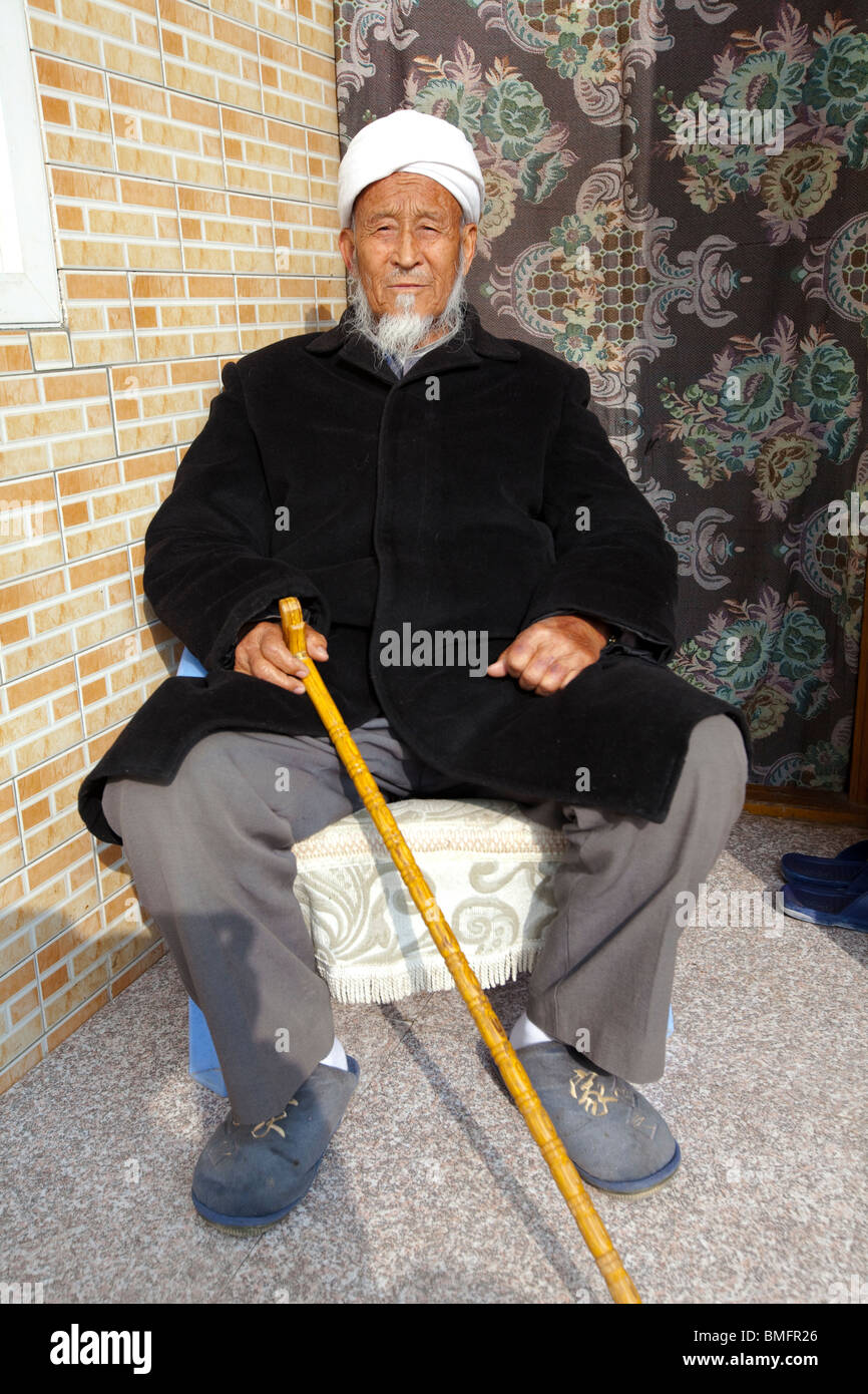 Old chinese man walking stick hi-res stock photography and images - Alamy