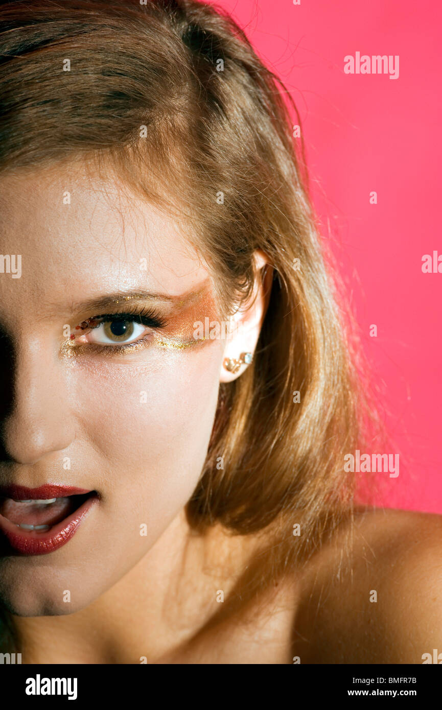 Beauty portrait of woman against pink background Stock Photo - Alamy