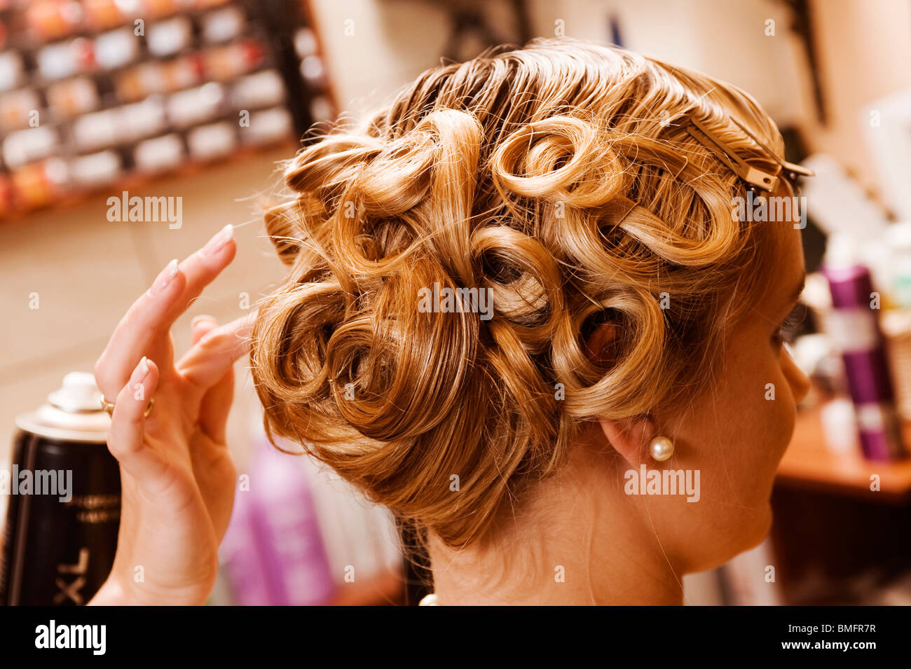 Person spraying hair Stock Photo - Alamy