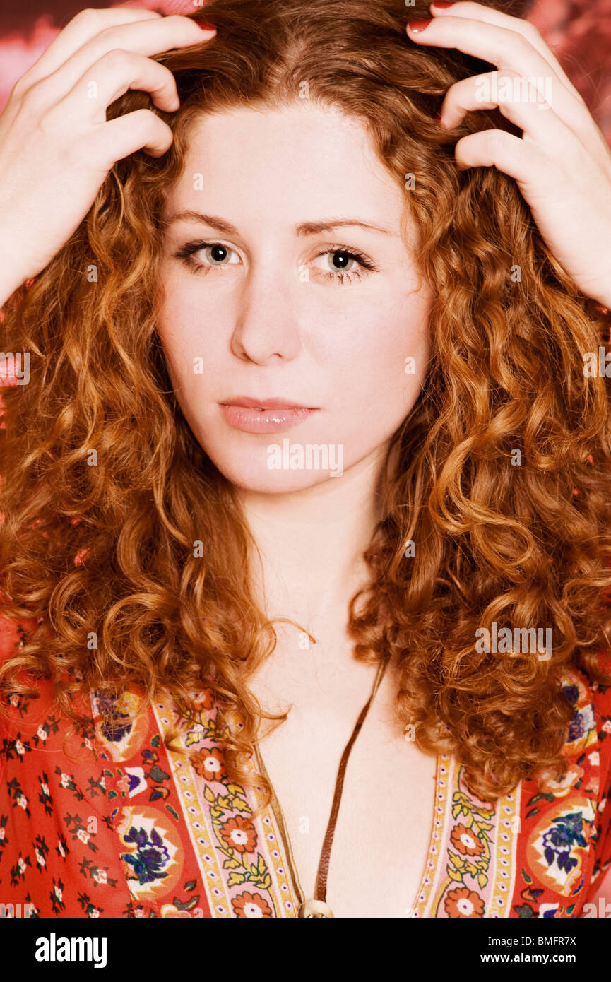 A beautiful woman with her hands in her hair Stock Photo - Alamy