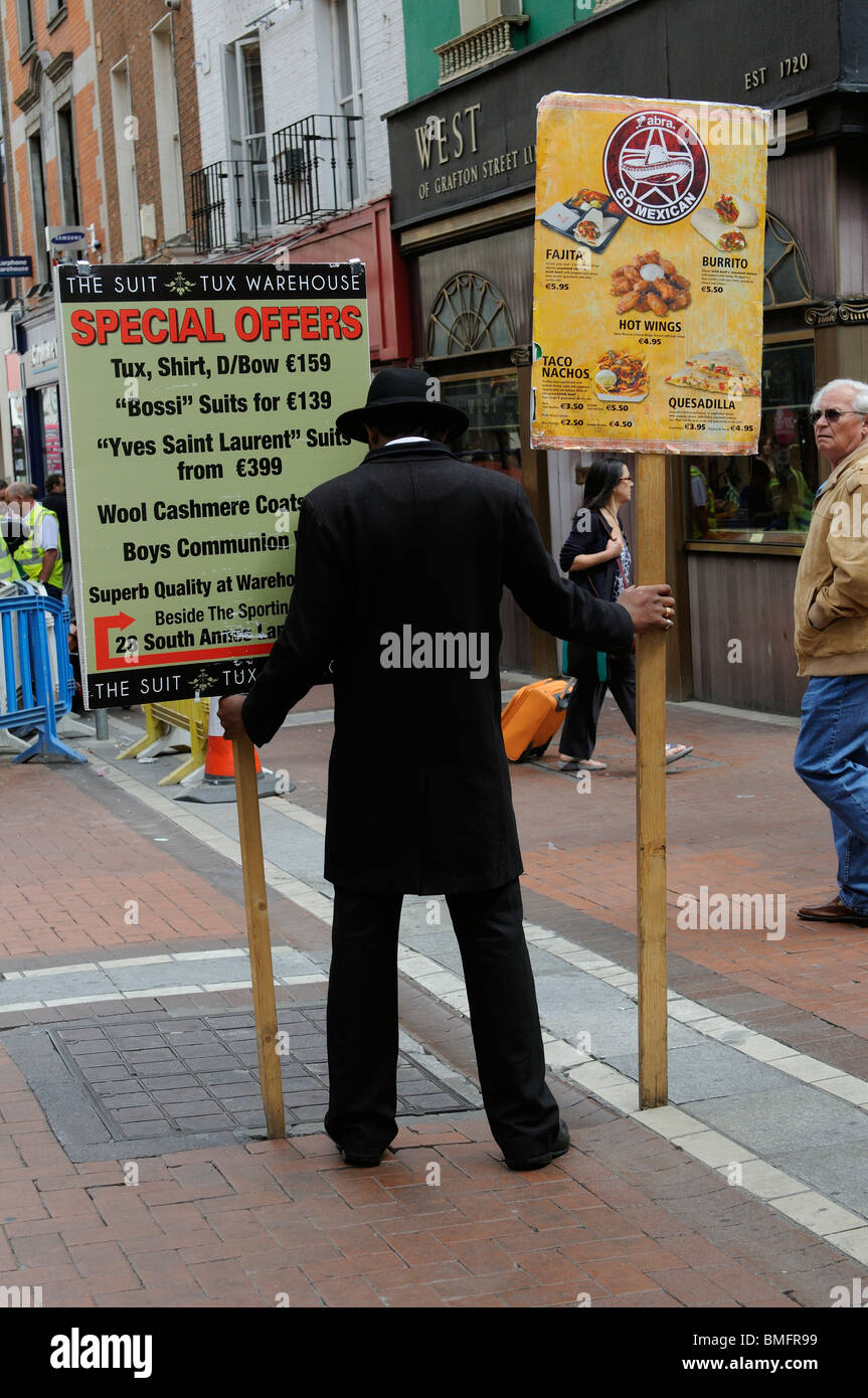 Sandwich board man holding advertising boards for Irish businesses on ...