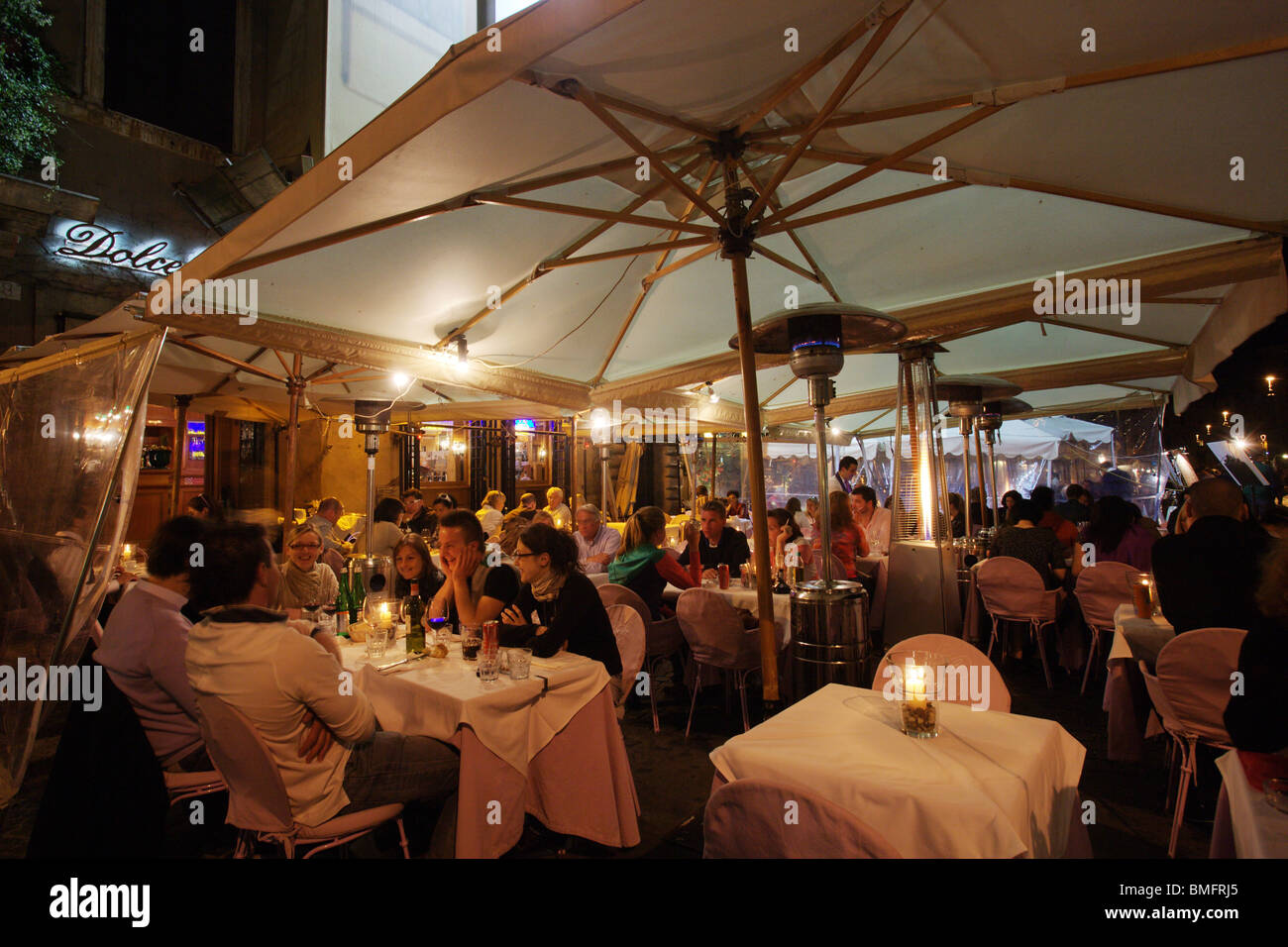 Typical restaurant pizzeria "Tre Scalini" with people eating in the ...