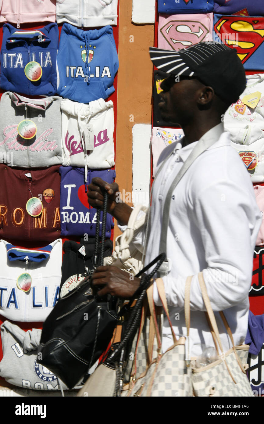 immigrant selling counterfeit goods in street in rome Stock Photo - Alamy