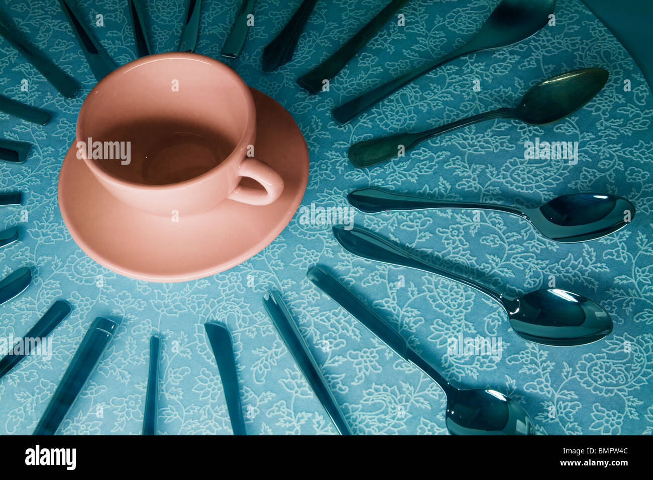 A teacup surrounded by silver teaspoons, Technology Museum, Berlin ...