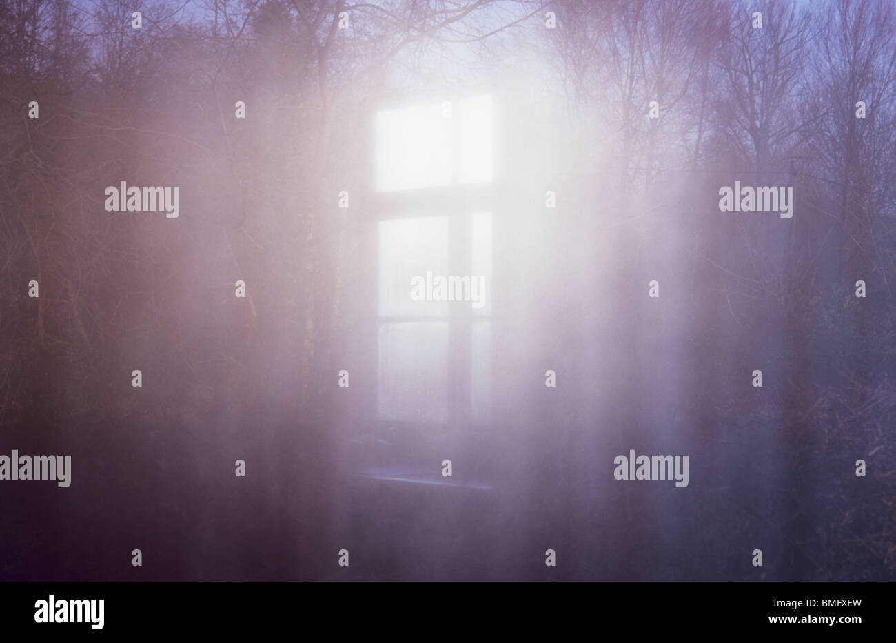 Impressionistic view through window with tree reflections and ...