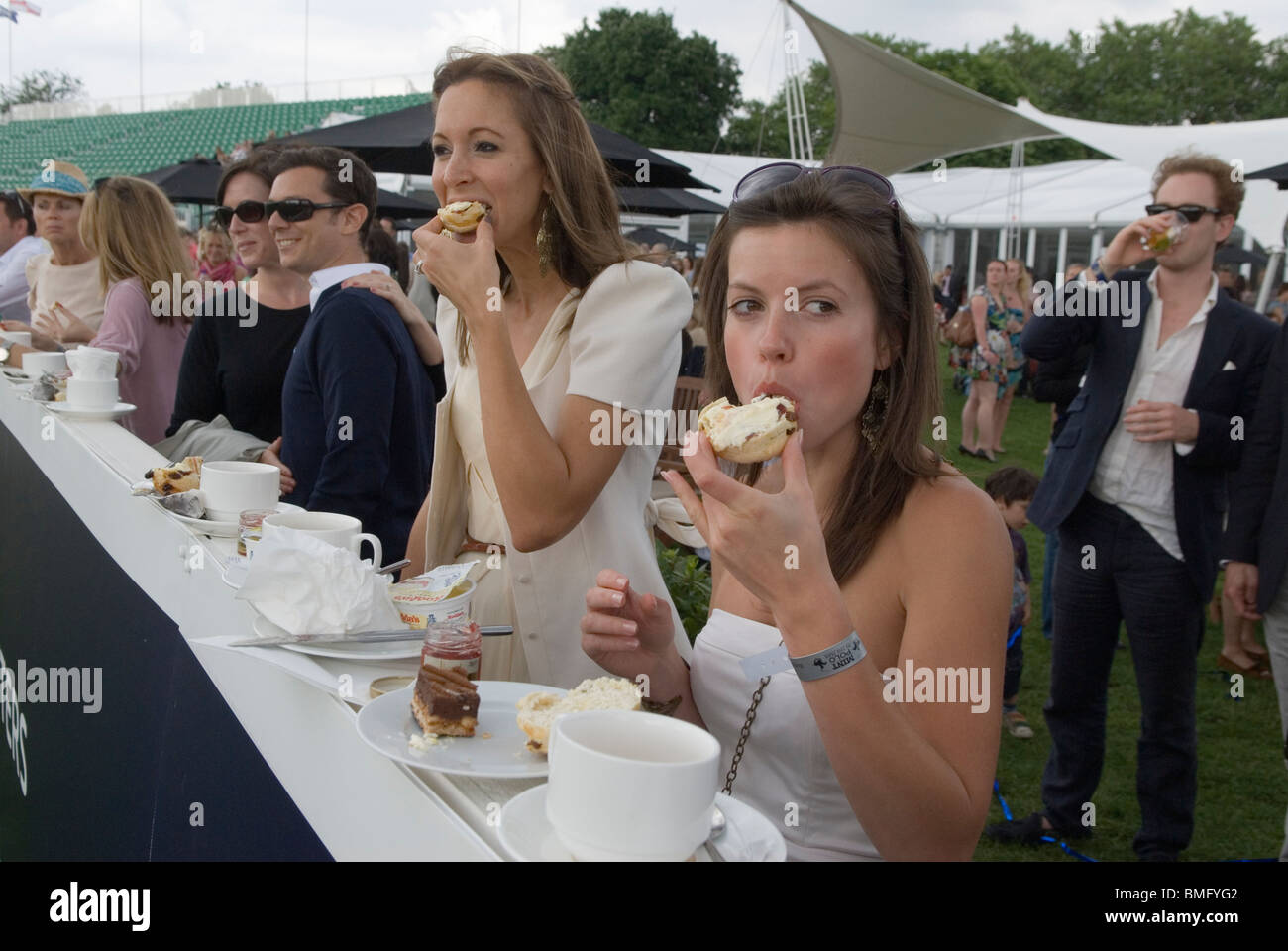 Afternoon tea UK Girls eating afternoon tea cakes Mint Polo in the Park ...