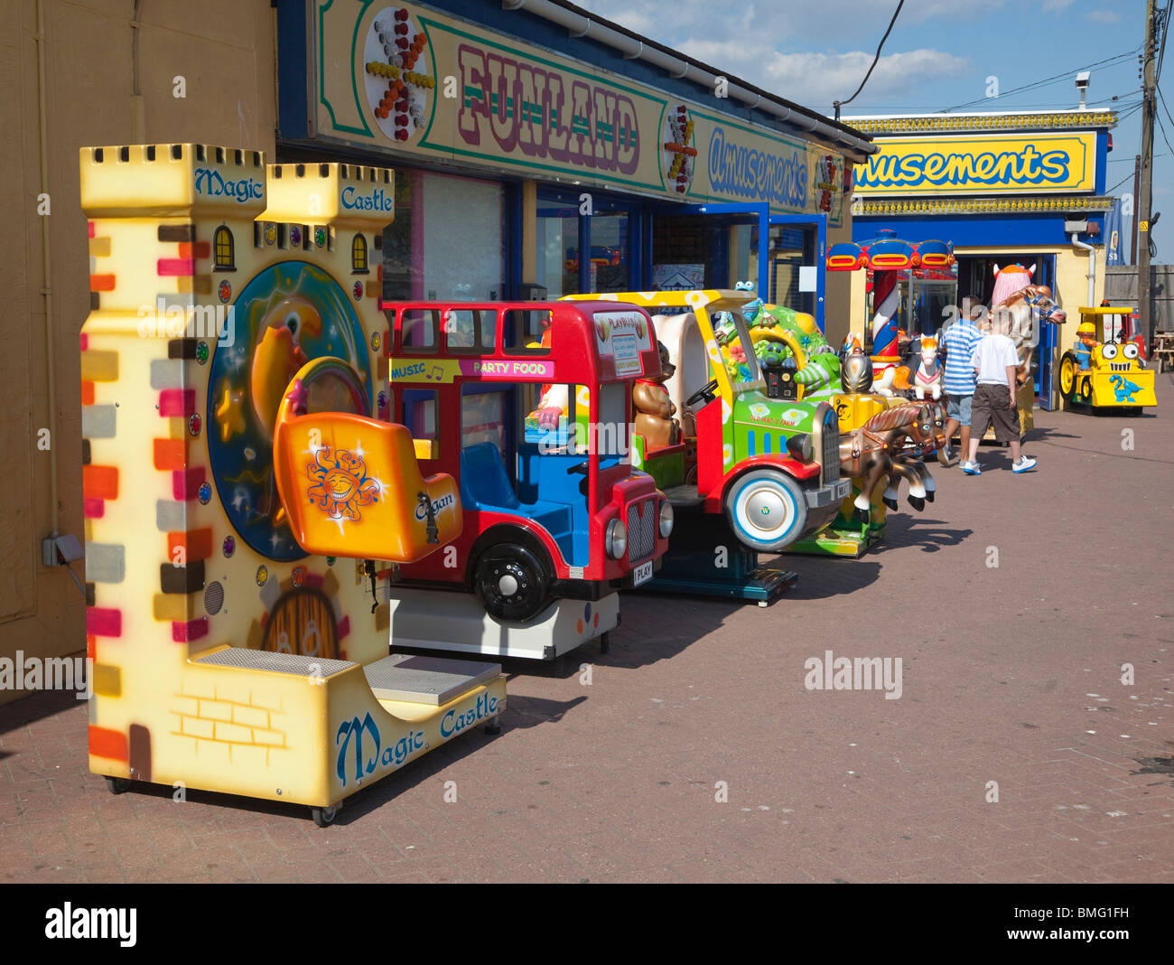 children's rides at an amusement arcade Stock Photo - Alamy