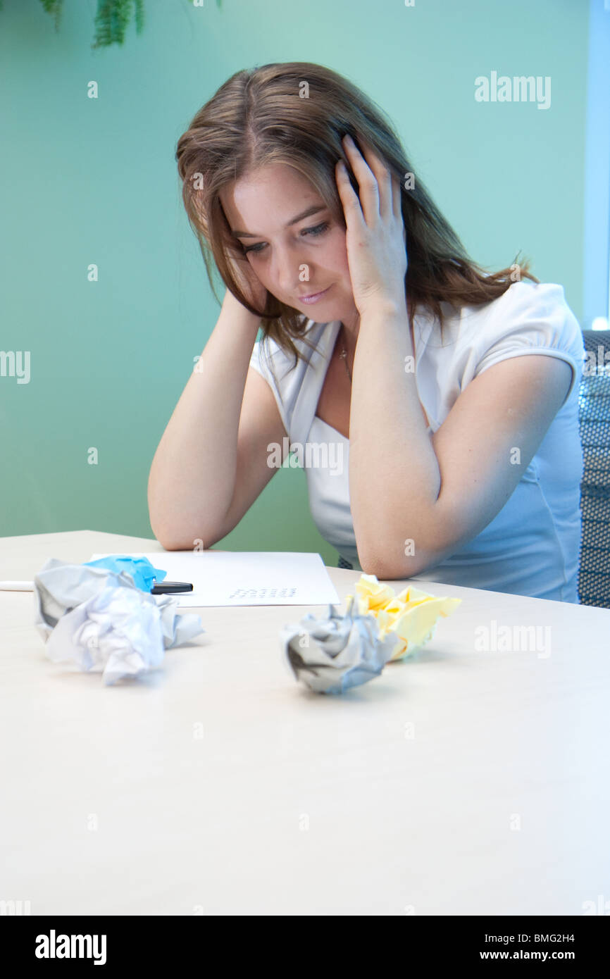 frustrated woman writing crumpled paper ball Stock Photo - Alamy