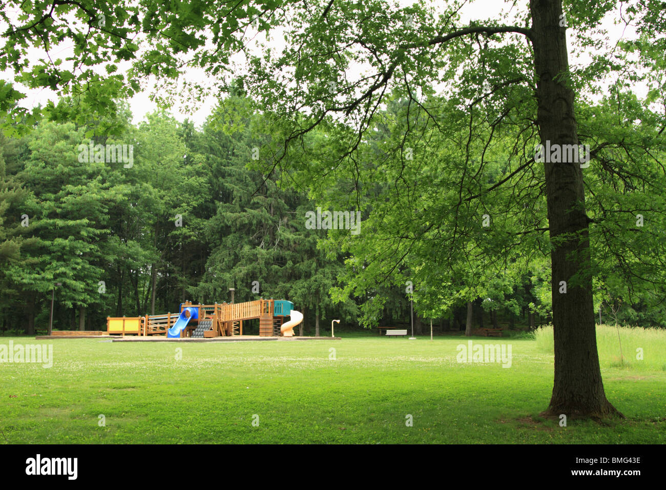 Playground in a park Stock Photo - Alamy