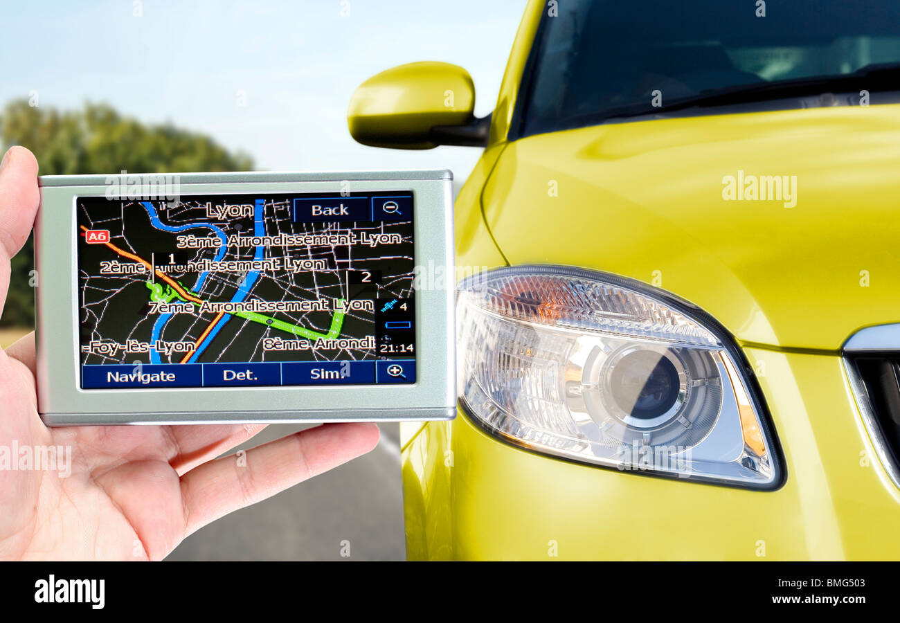 Gps in a man hand. Find your way ! Stock Photo - Alamy