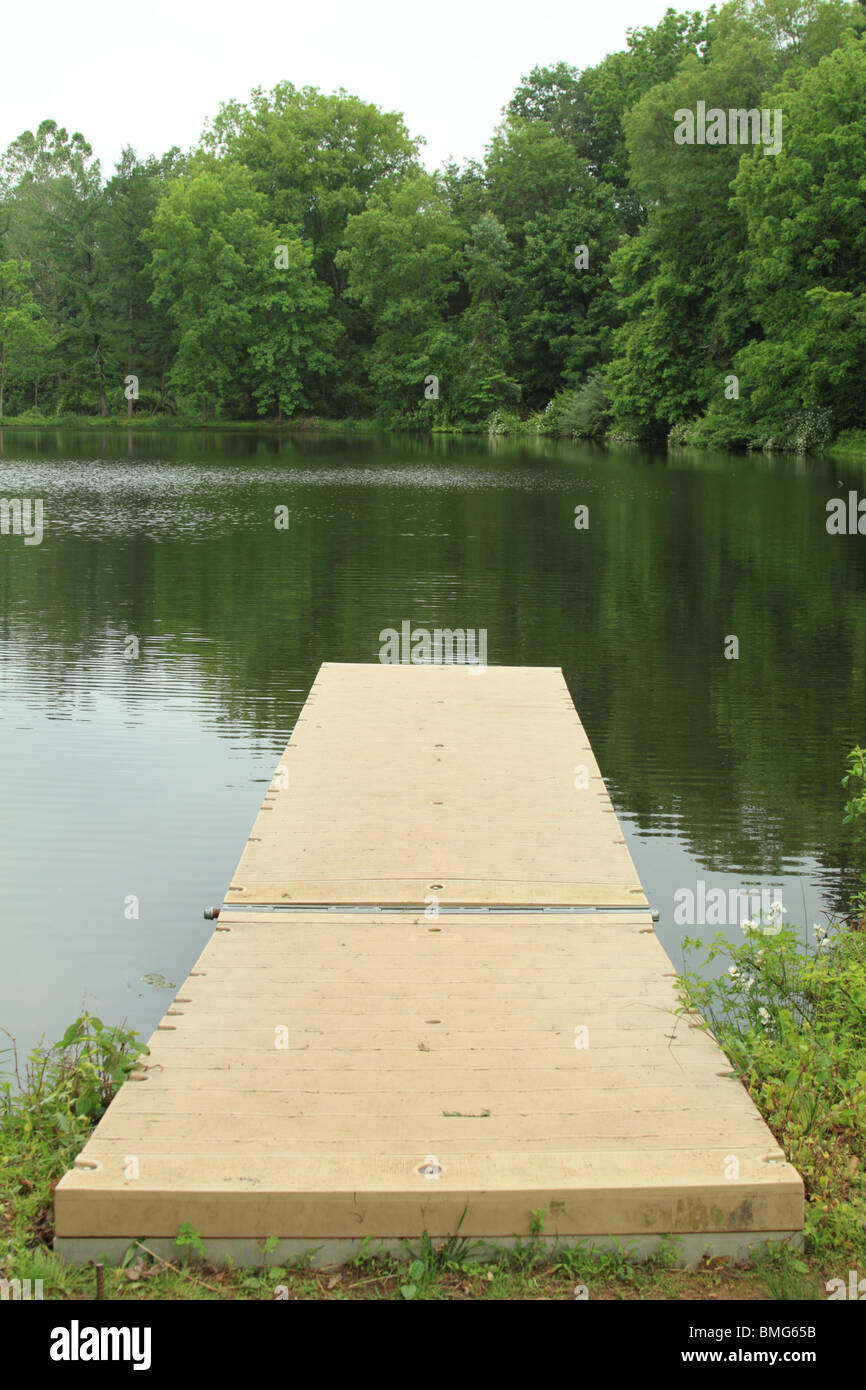 Dock on pond Stock Photo - Alamy
