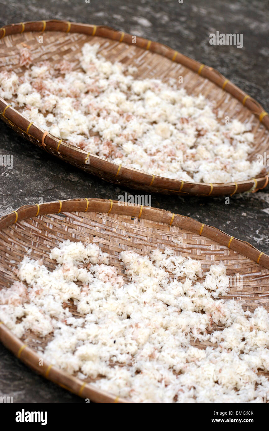 Offering of cooked rice to monks. Buddhist monastery Luang Prabang ...