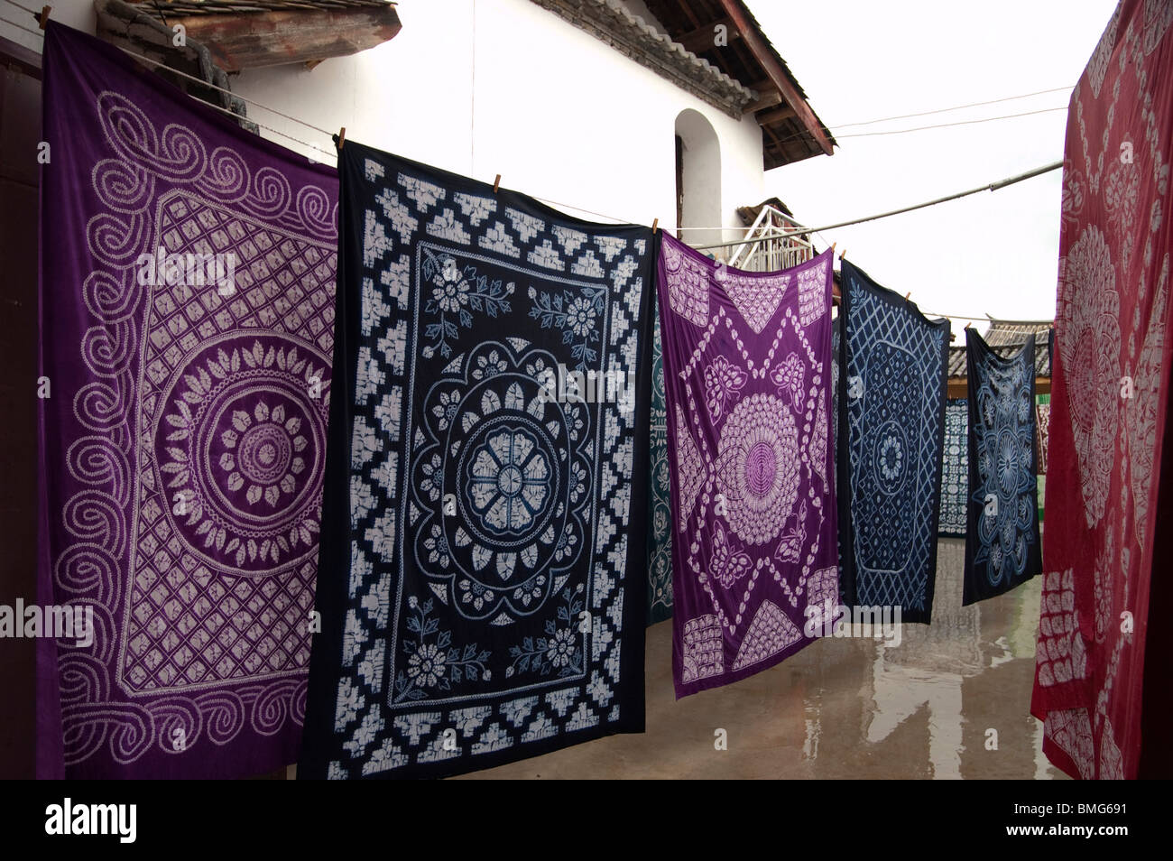 Batik fabric hanging to dry in local batik workshop, Old Town of ...