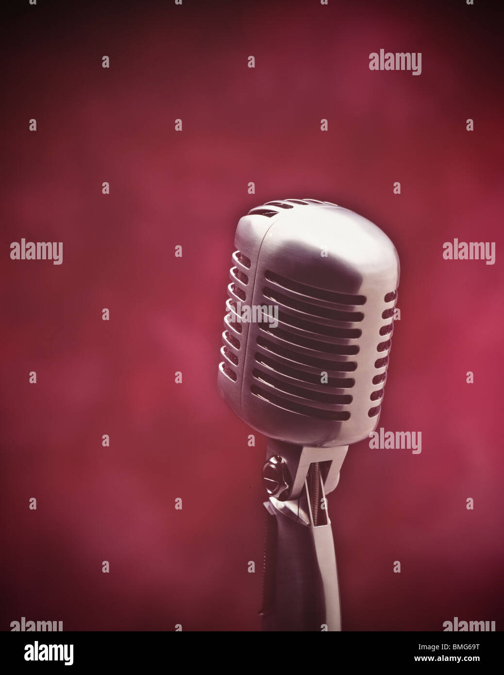 Microphone red background, copy space Stock Photo - Alamy