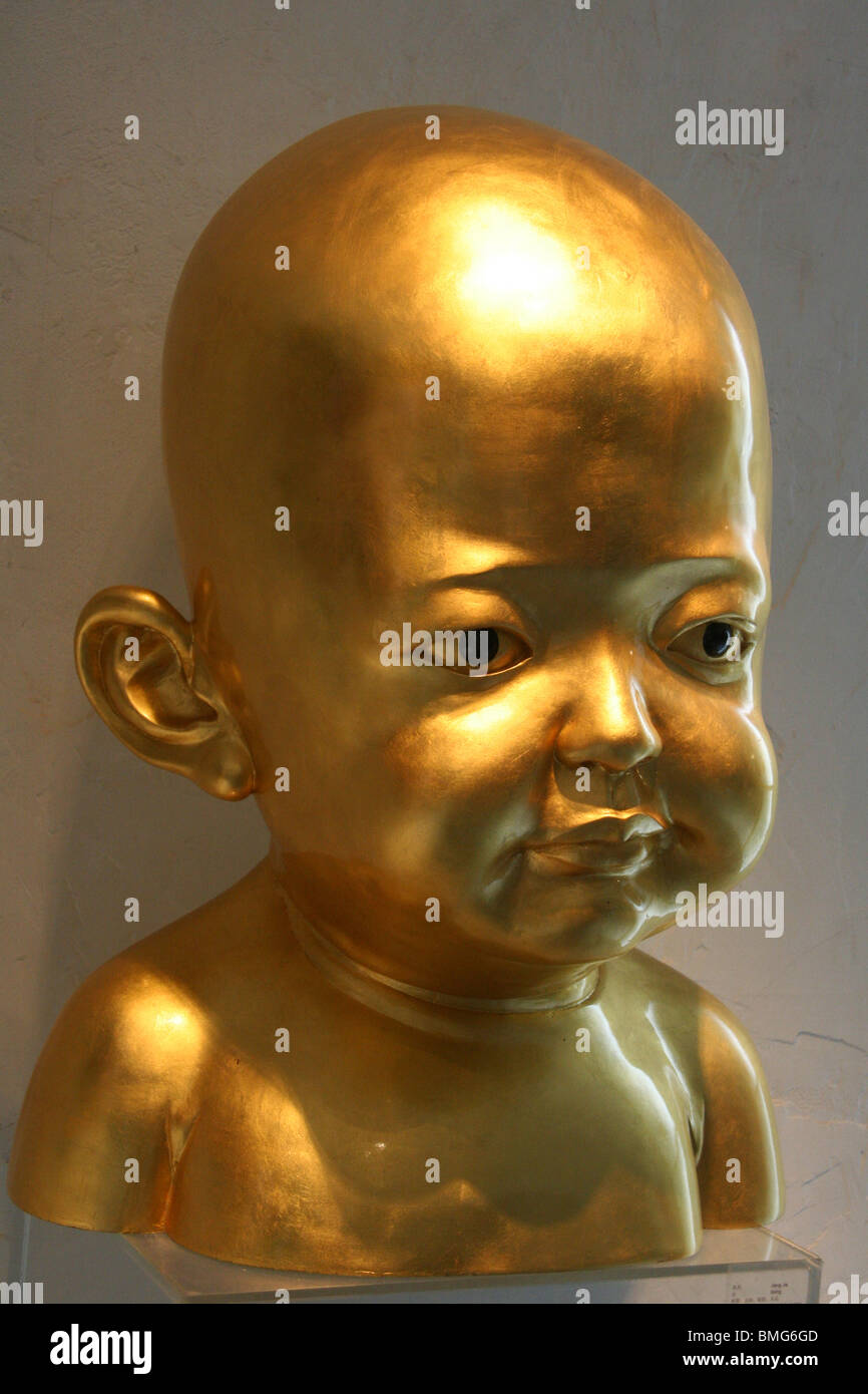 Gold gilded baby bust statue in 798 Art District, Beijing, China Stock ...