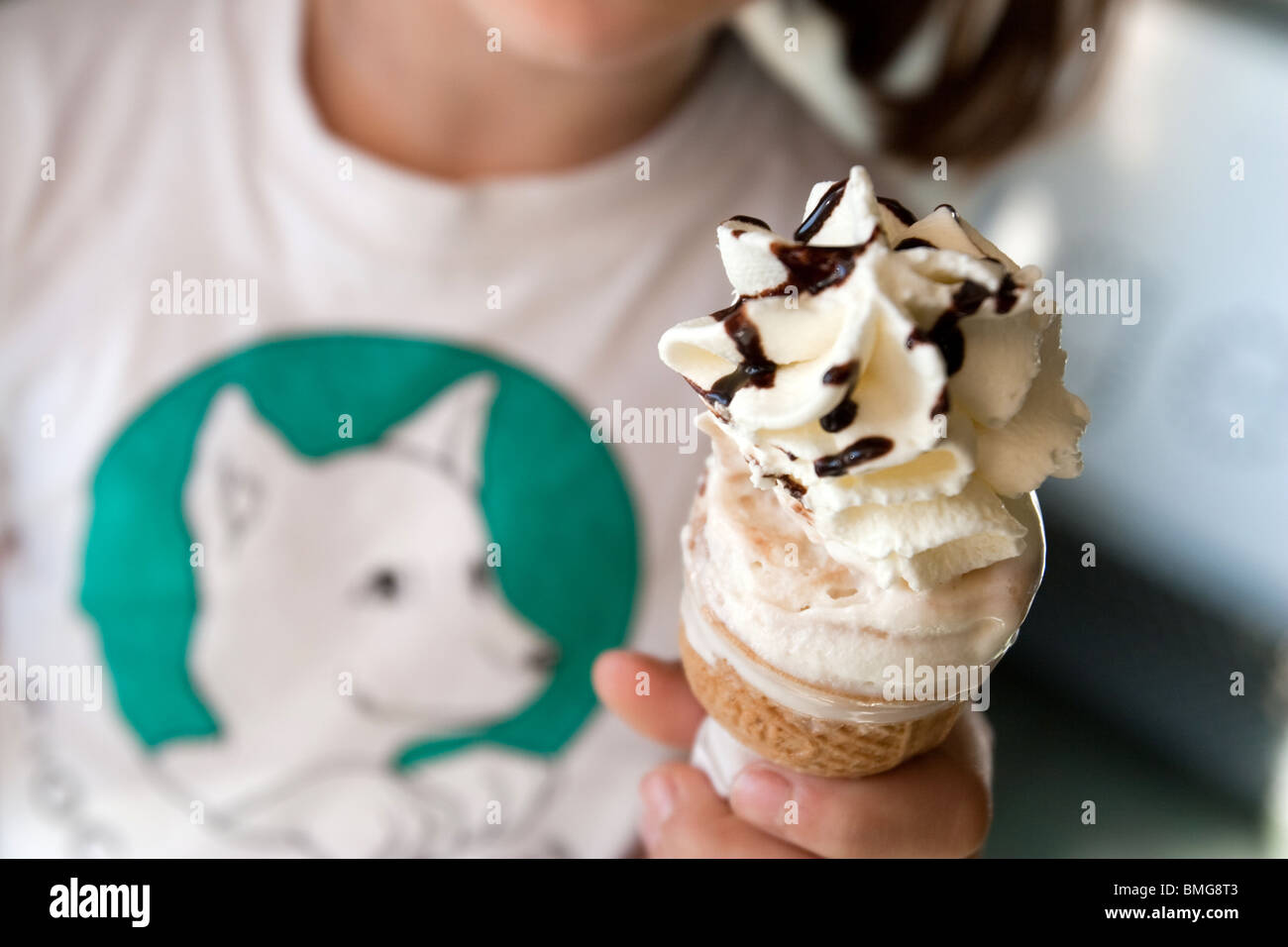 Girl eating "ice cream" gelato cone outdoor in Italy Stock Photo - Alamy