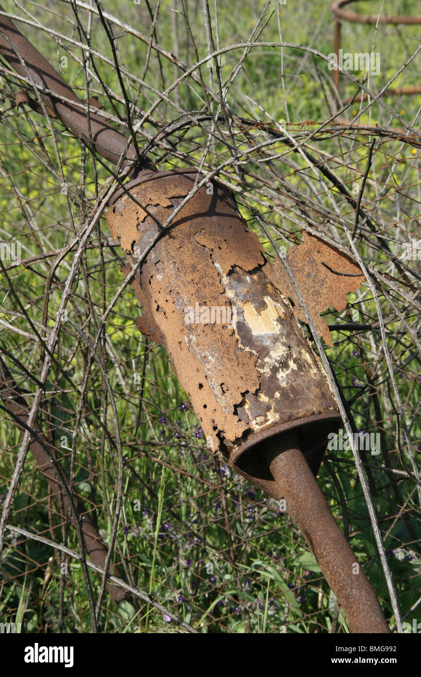 old rusty car exhaust pipe in field Stock Photo - Alamy