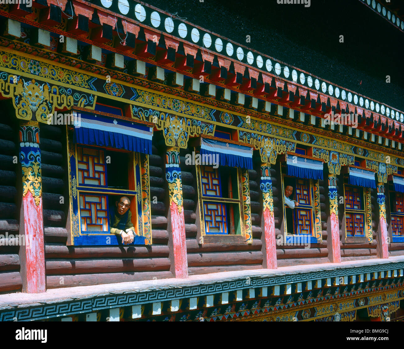 Tibetan craftsman looking out of the window, Dege Sutra Printing House ...