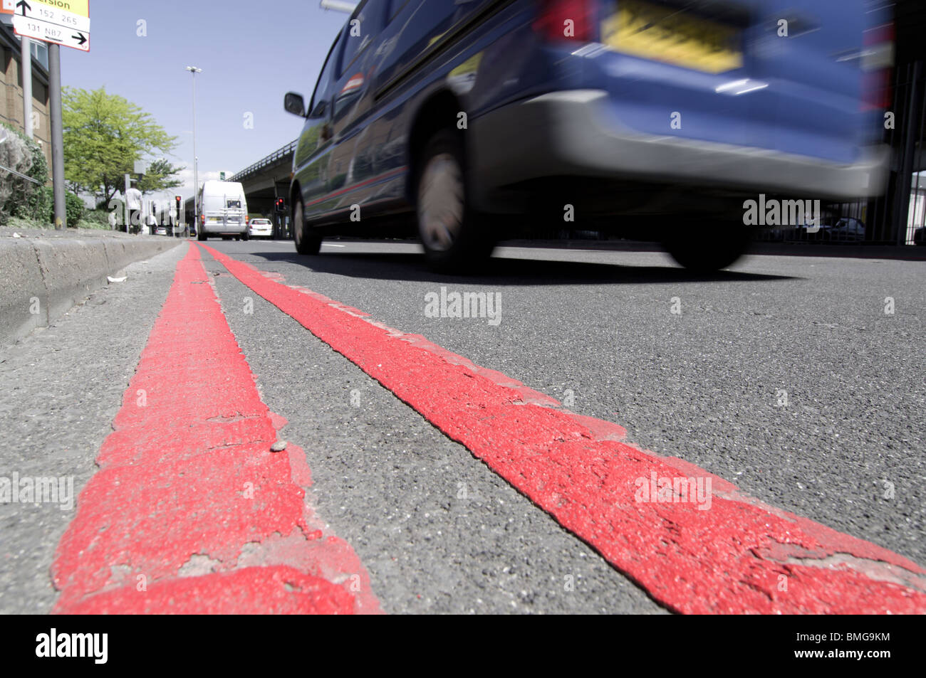 Closeup of red lines on red route no parking rush hour route Stock ...