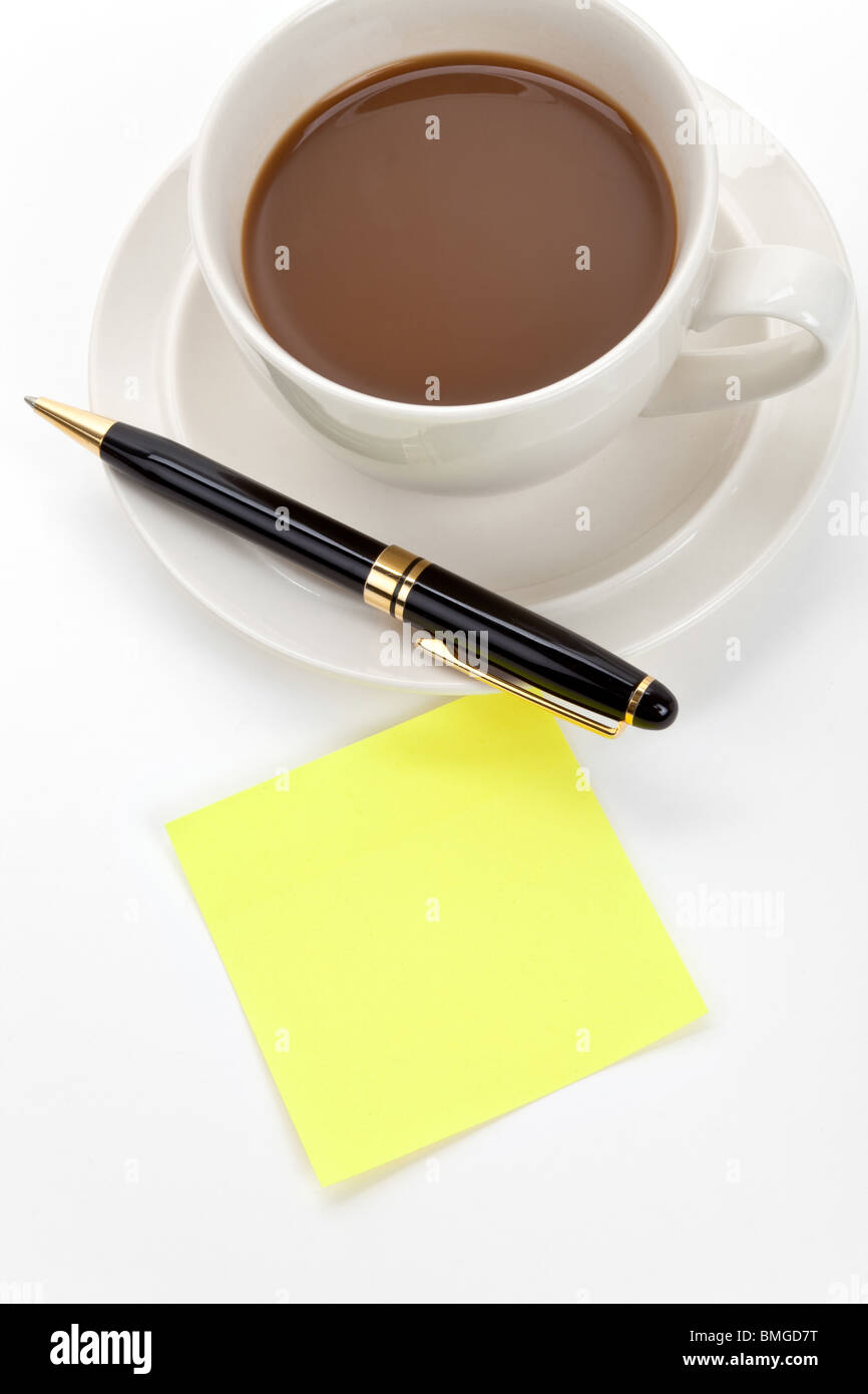 Coffee cup and note pad close up Stock Photo - Alamy