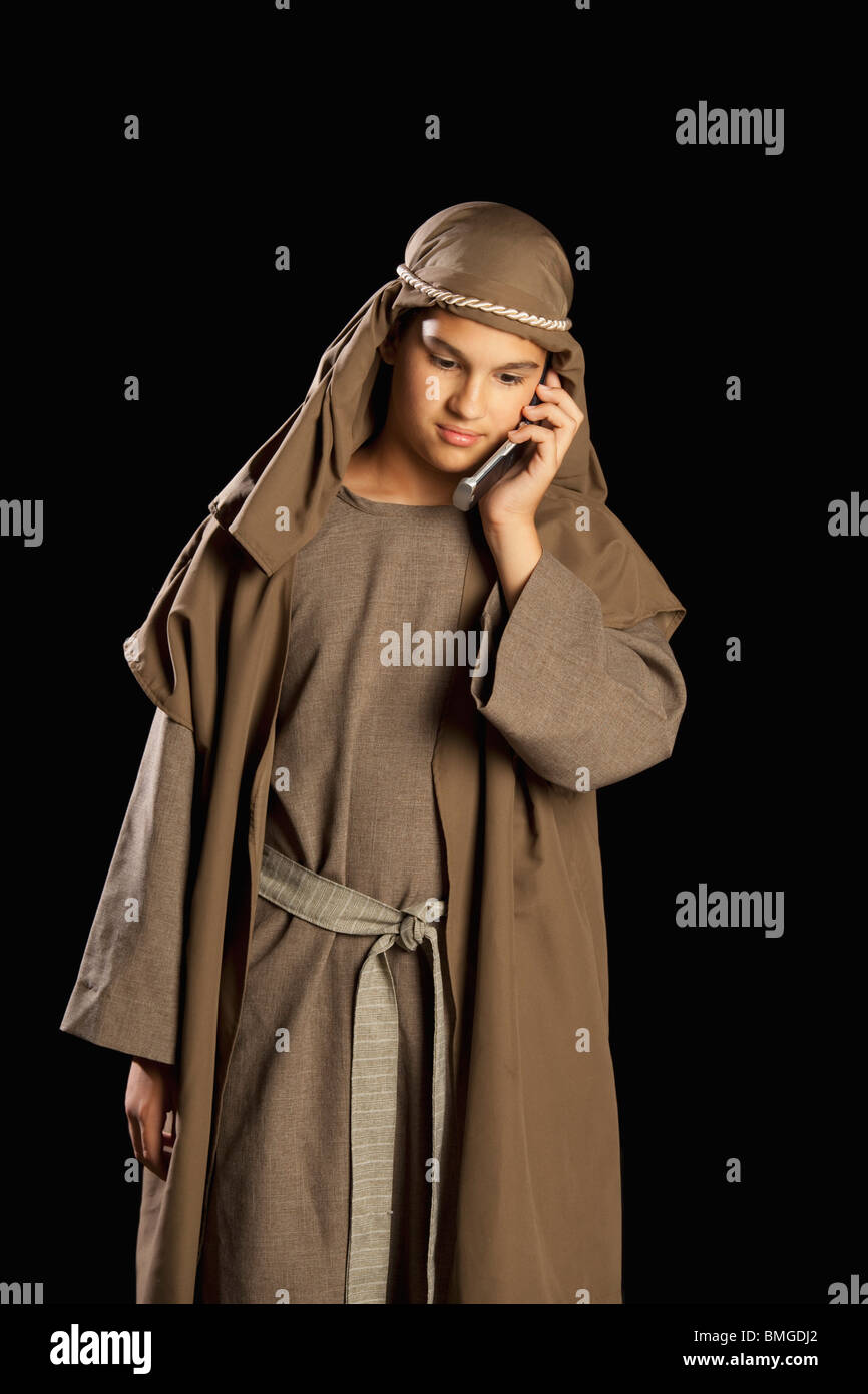 Boy Depicting Jesus Holding A Cellphone Stock Photo - Alamy