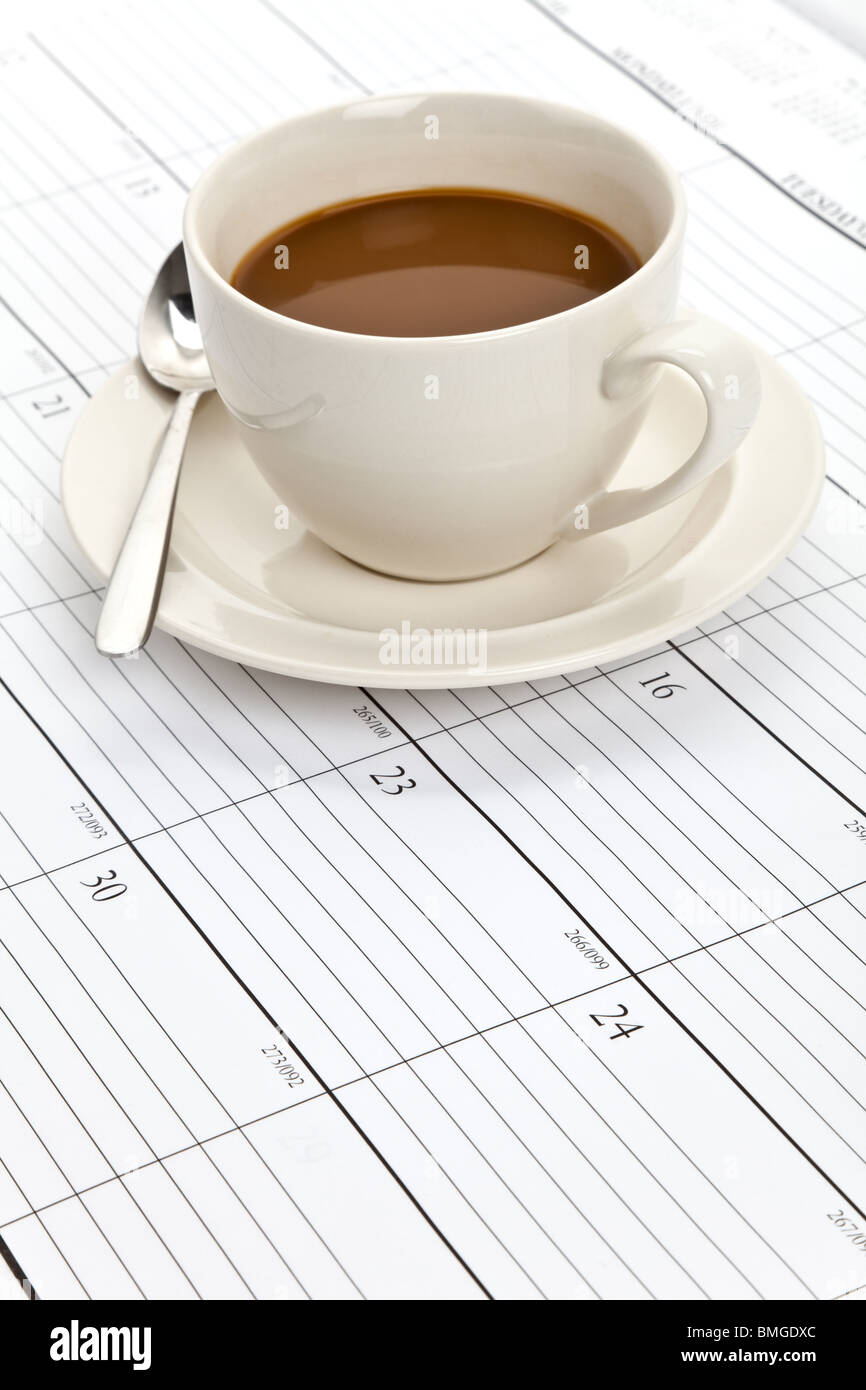 Coffee cup and Calendar close up Stock Photo - Alamy