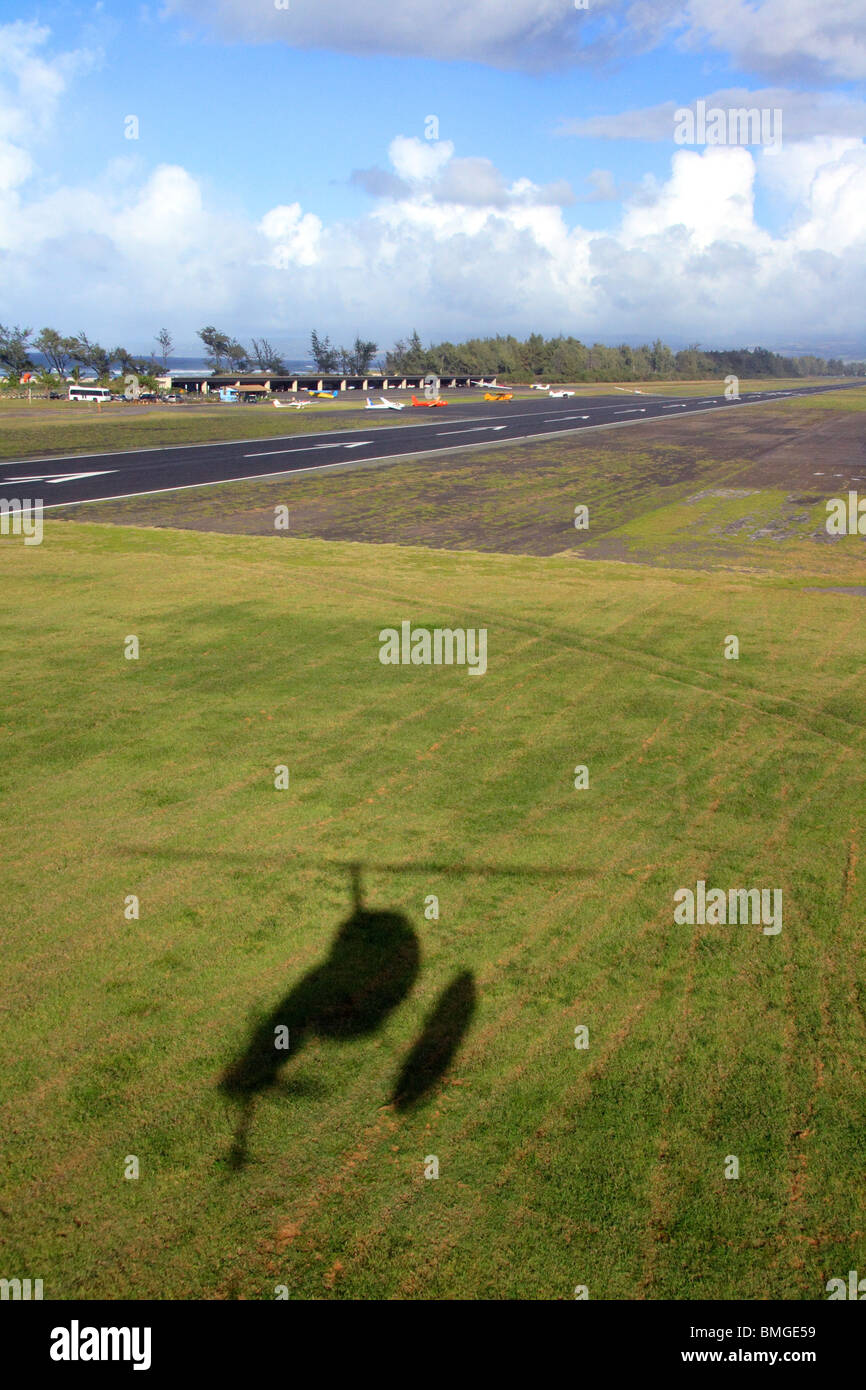 Aerial view and shadow of helicopter landing at Dillingham Airfield ...