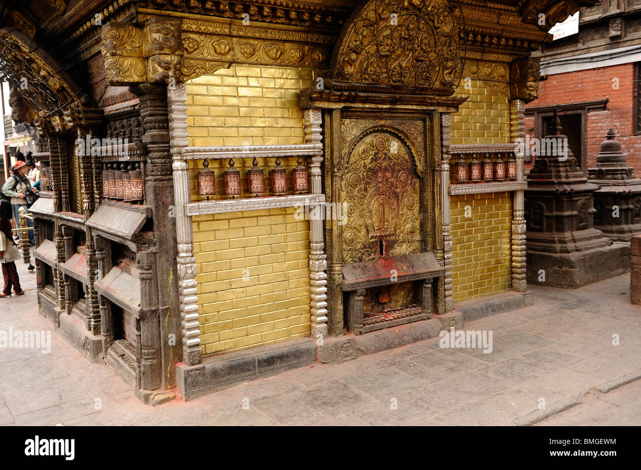pilgrims circulating the temple spin each wheel ,the hariti temple ...