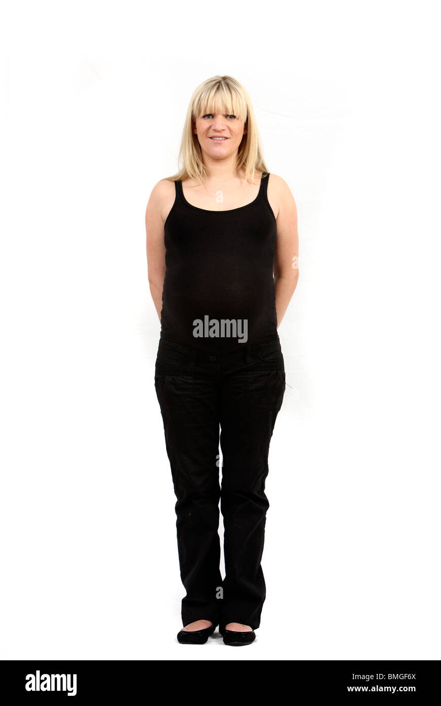 Young, pregnant woman, 9th month Stock Photo - Alamy